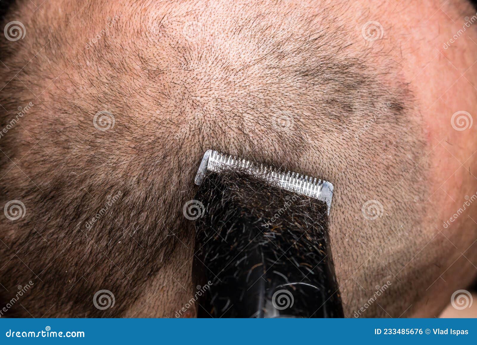 Man Shaving or Trimming His Hair Using a Hair Clipper Stock Photo ...
