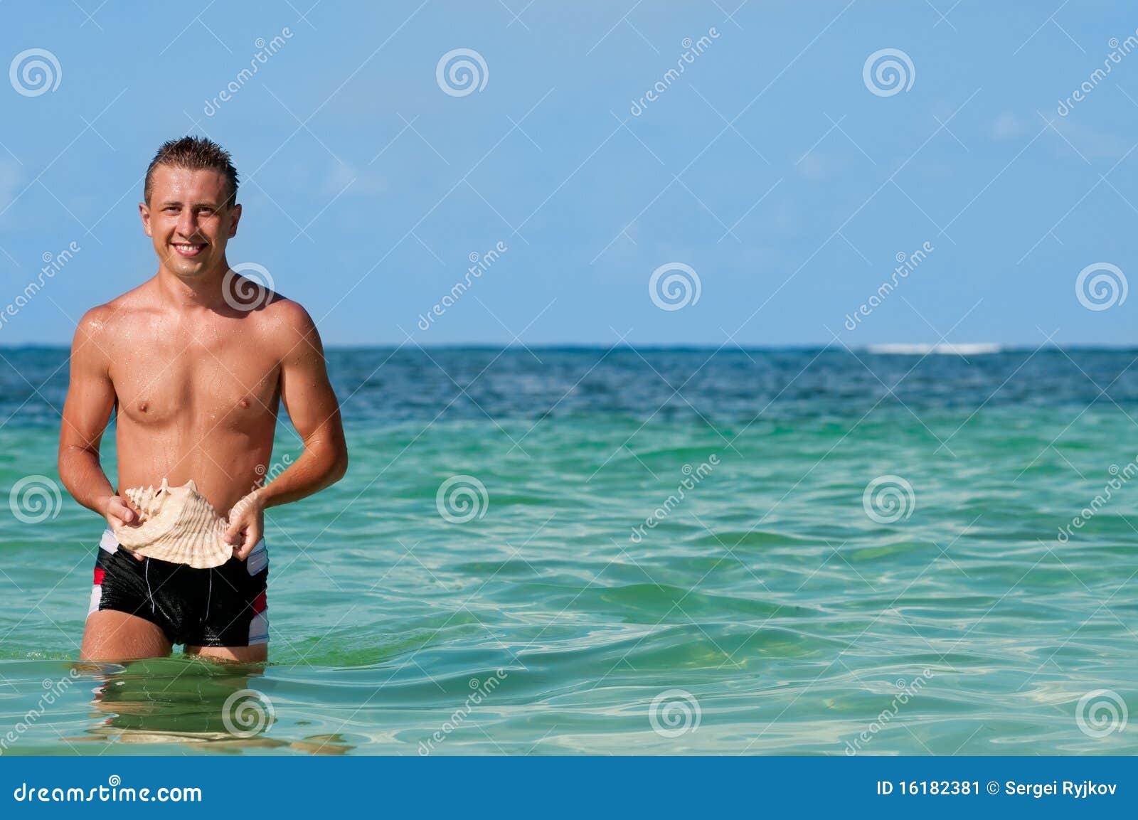 A man with a shell stock image. Image of male, blue, natural - 16182381