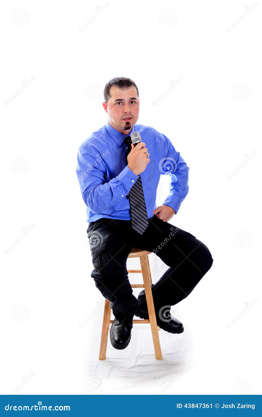 Man in Shirt and Tie Speaking into Microphone Stock Image - Image of ...
