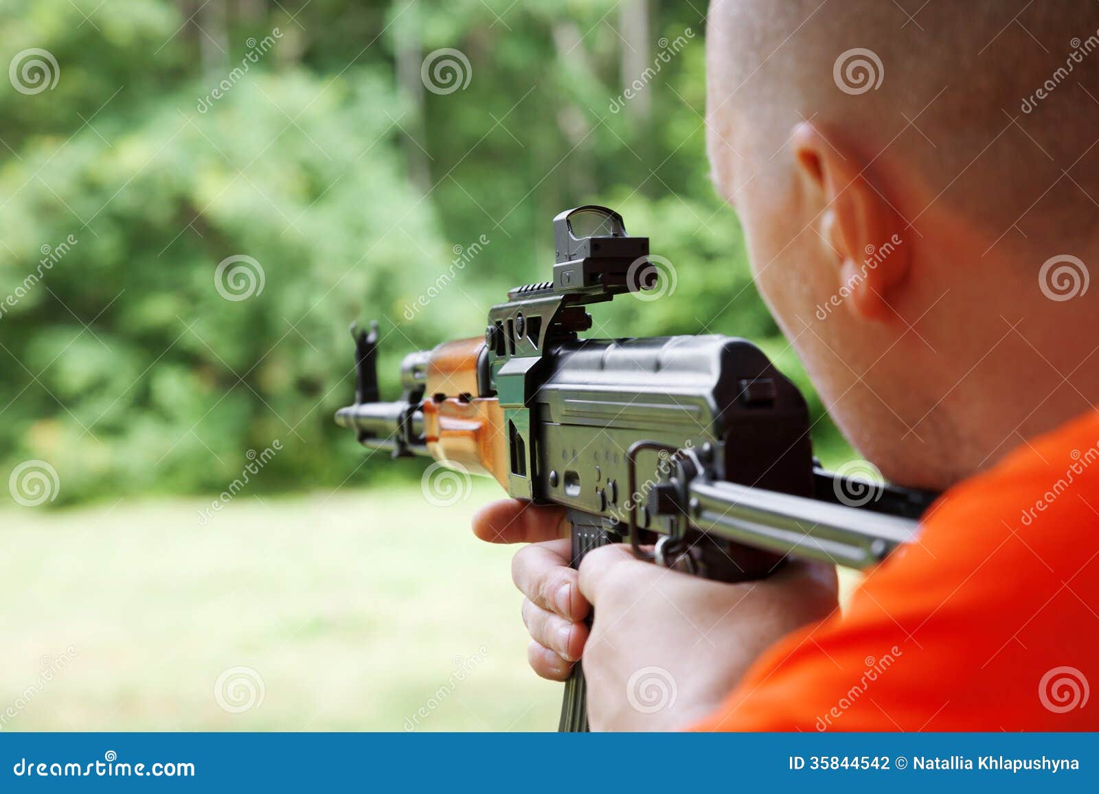 Man Shooting an Automatic Rifle Stock Photo - Image of rifle, game ...