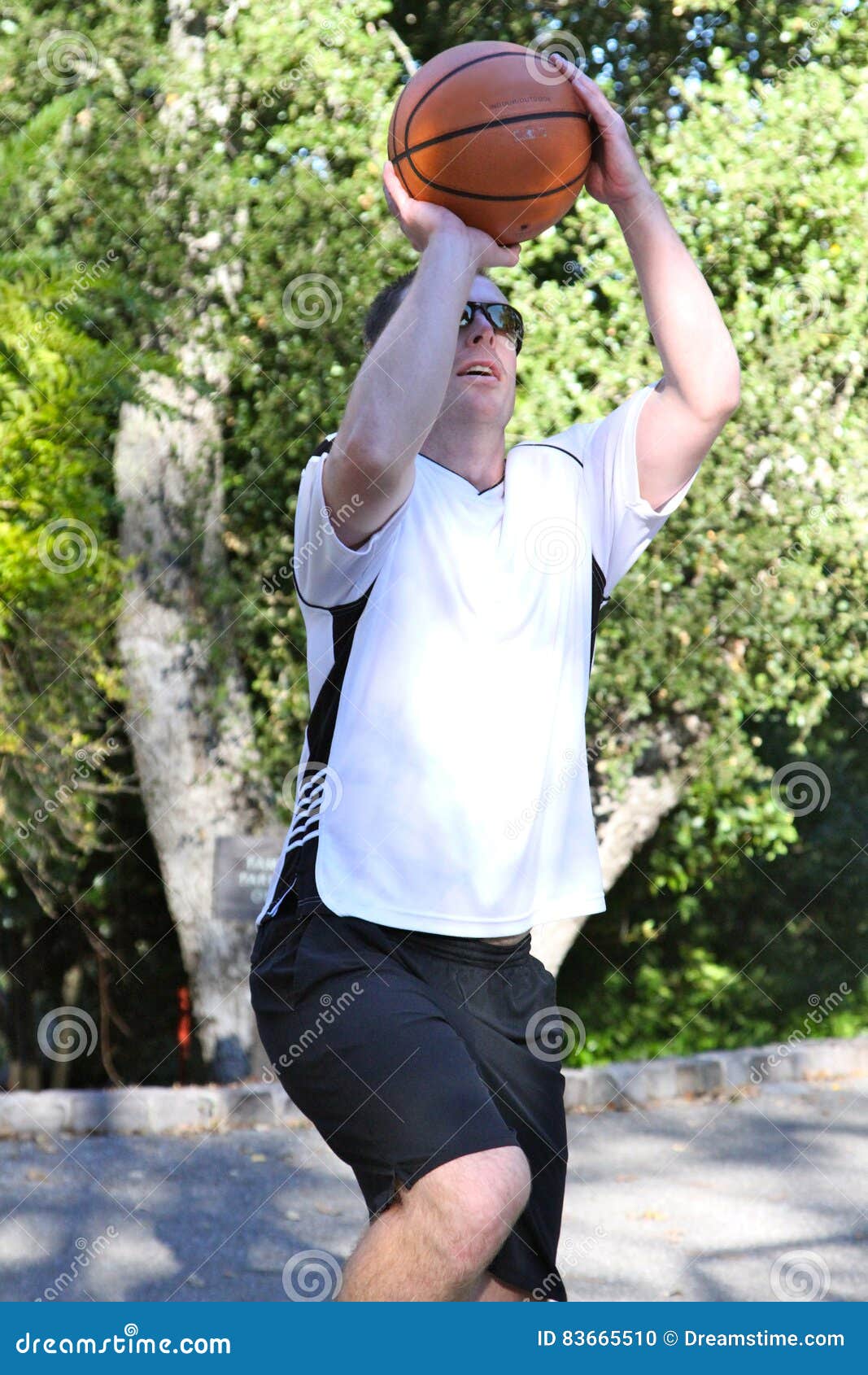 Man Shooting Basketball Outside Stock Photo - Image of shooting, ball ...