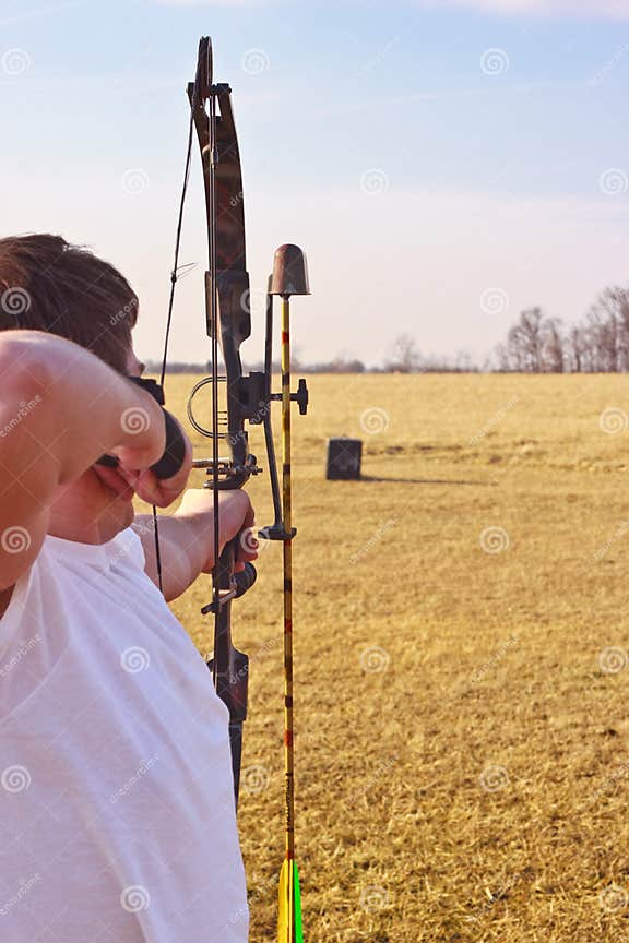 Man shooting bow stock image. Image of safety, compound - 19634139