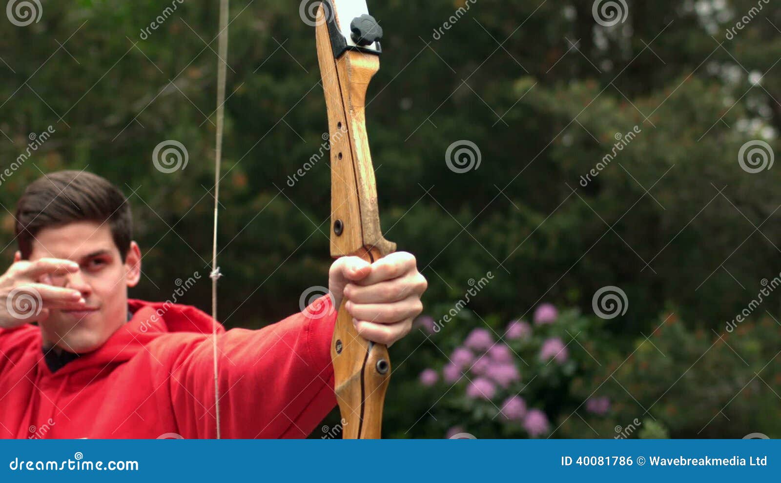 Man shooting bow and arrow stock footage. Video of definition - 40081786