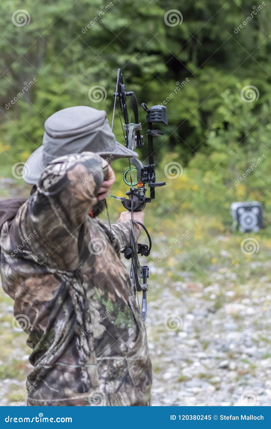 A Man in Camo Shooting a Compound Bow at a Target Editorial Image ...