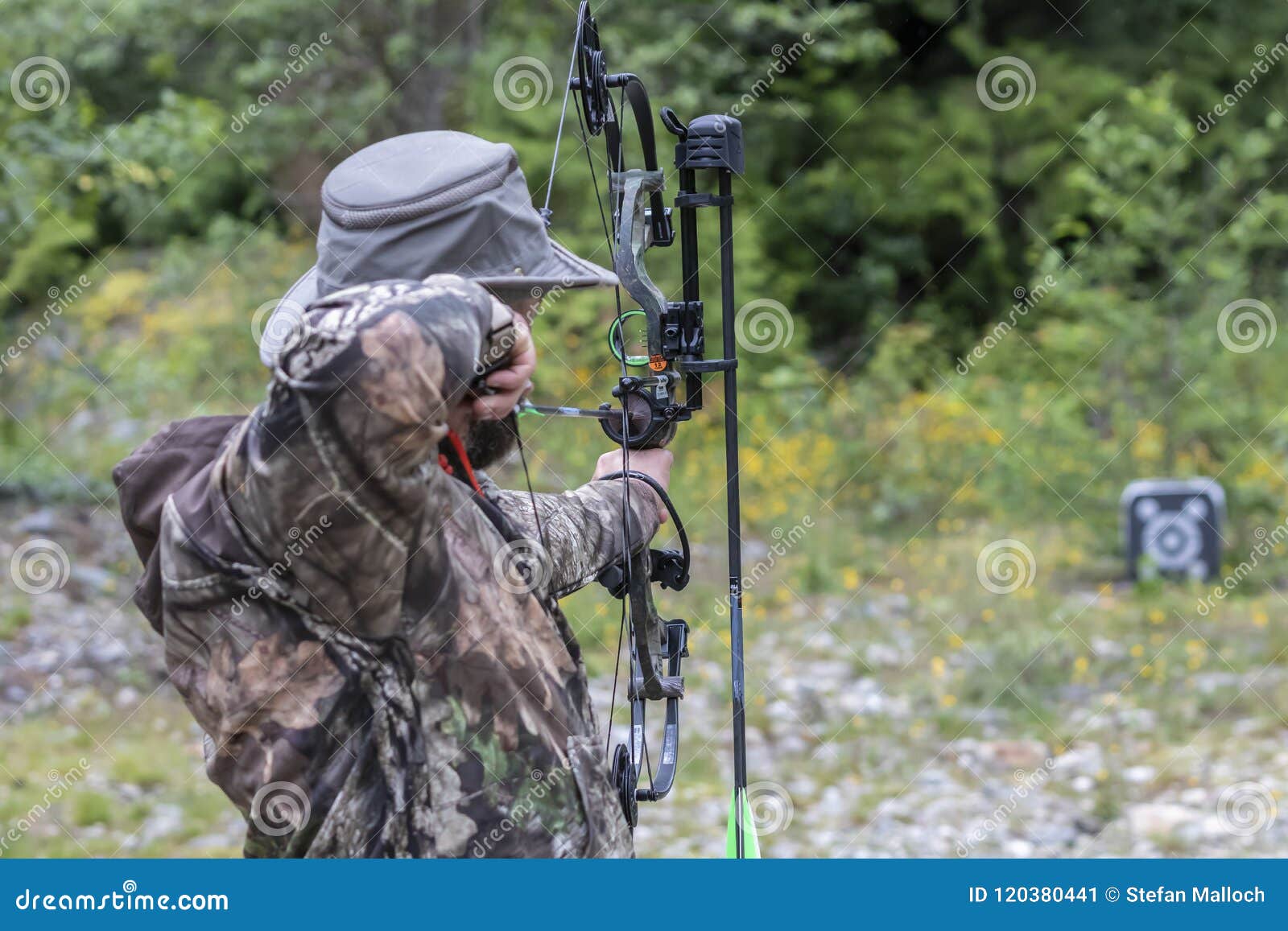 A Man Shooting a Compound Bow at a Target Editorial Photo - Image of ...