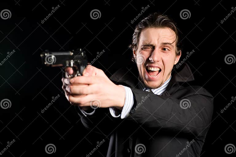 Man shooting a gun stock photo. Image of criminal, modern - 24924244