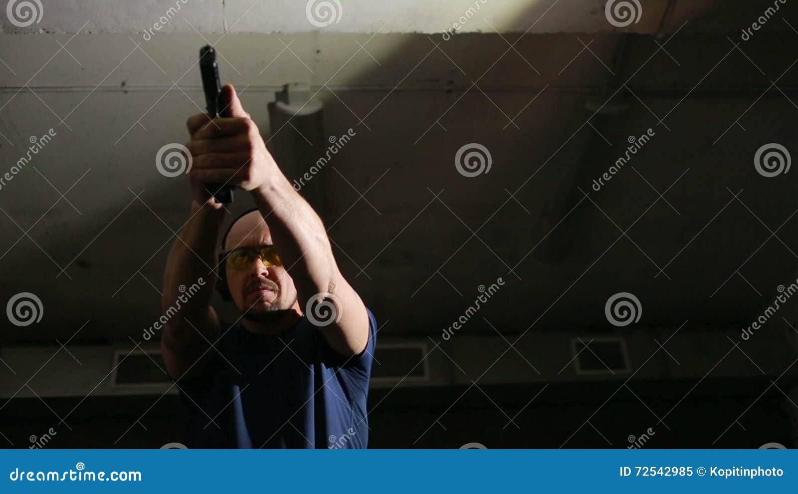 Man Shooting a Gun. Man Shoots at a Shooting Range Stock Video - Video ...