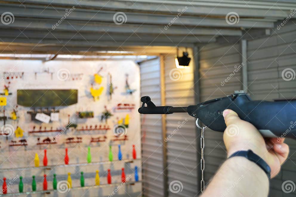 A Man in a Shooting Range Fires a Black Rifle Stock Photo - Image of ...