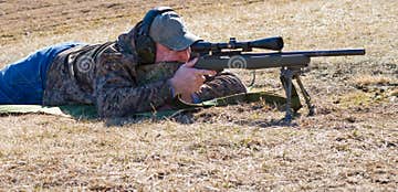 Man Shooting Rifle stock photo. Image of optic, sport - 13060052
