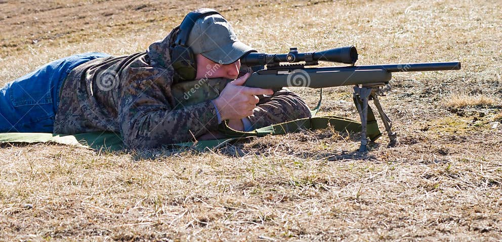 Man Shooting Rifle stock photo. Image of optic, sport - 13060052