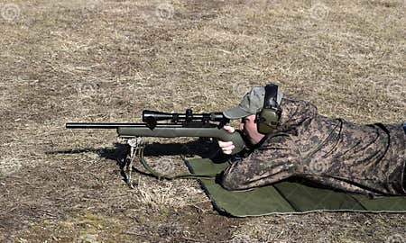 Man Shooting Rifle stock photo. Image of optic, position - 15095318