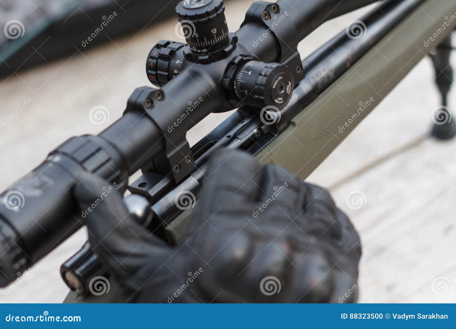 A Man Shoots a Rifle. Rifle Shooting with Optical Sight Outdoors by Man ...
