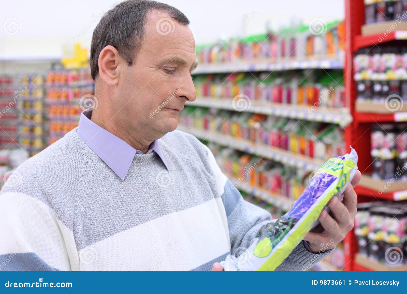 Man in Shop with Package in Hands Stock Image - Image of choose, male ...