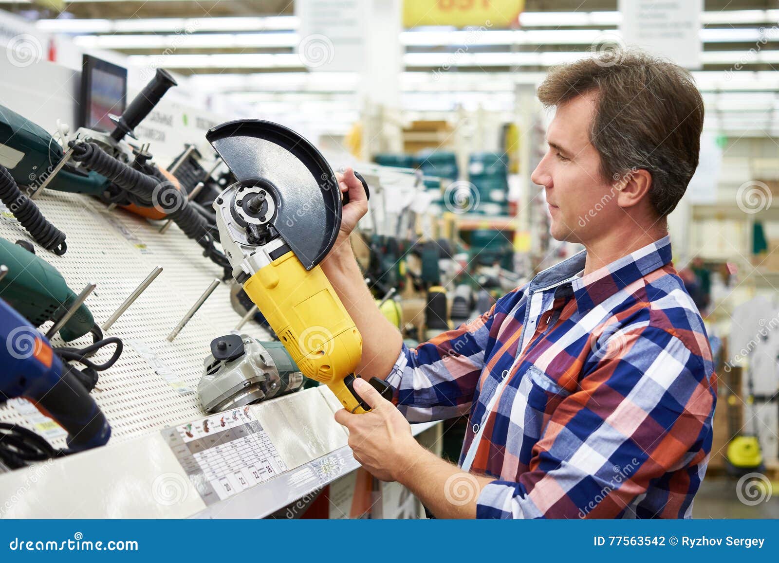 Man Shopping for Angle Grinder in Hardware Store Stock Photo - Image of ...