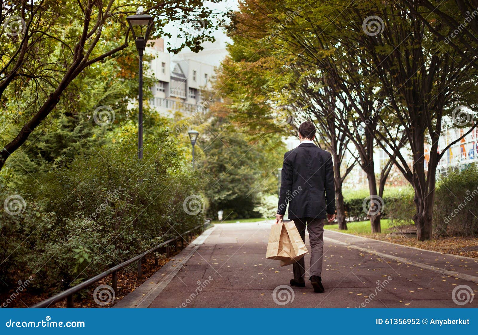Man Shopping Bags Walks Alone Stock Photos - Free & Royalty-Free Stock ...