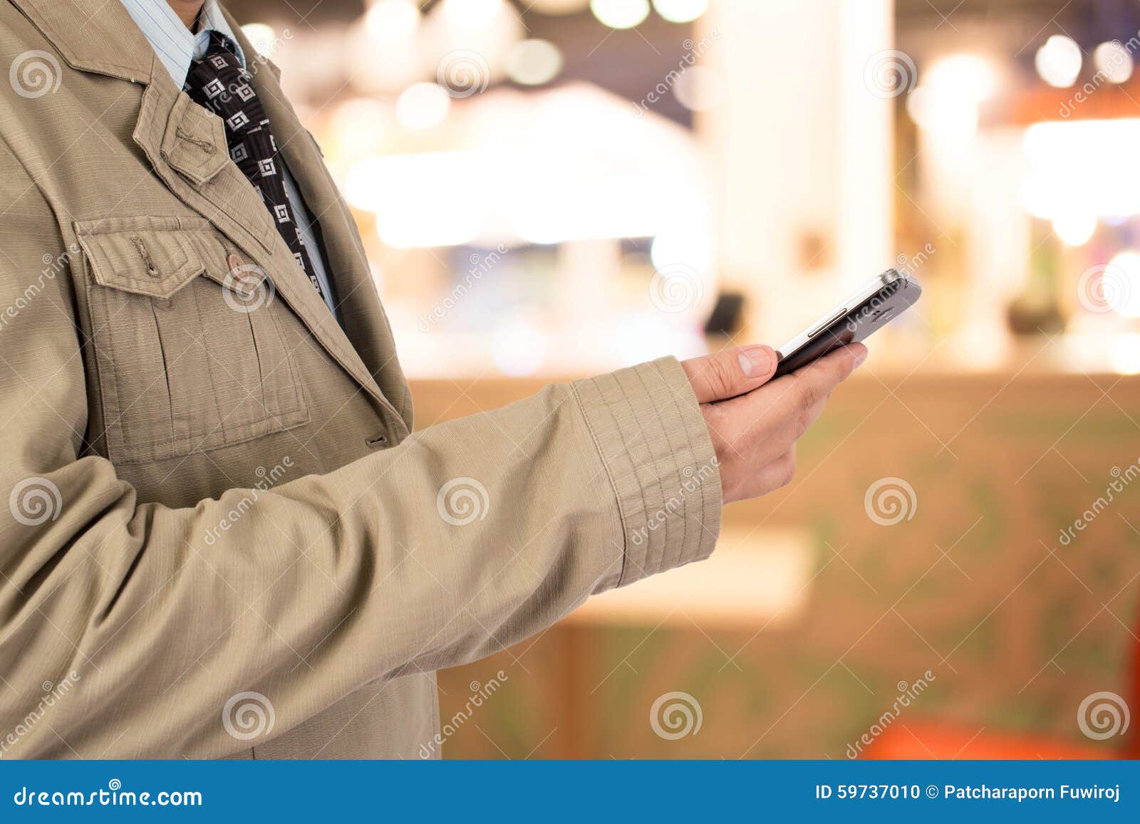 Man in Shopping Mall Using Mobile Phone. Stock Photo - Image of ...