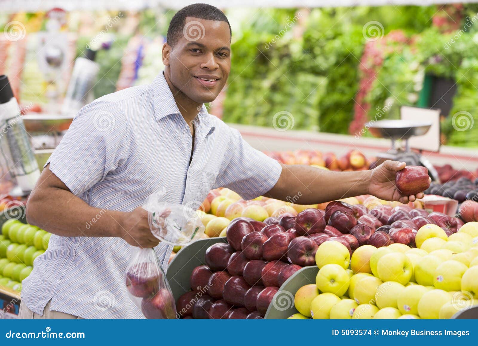Man Shopping in Produce Section Stock Photo - Image of male, eating ...