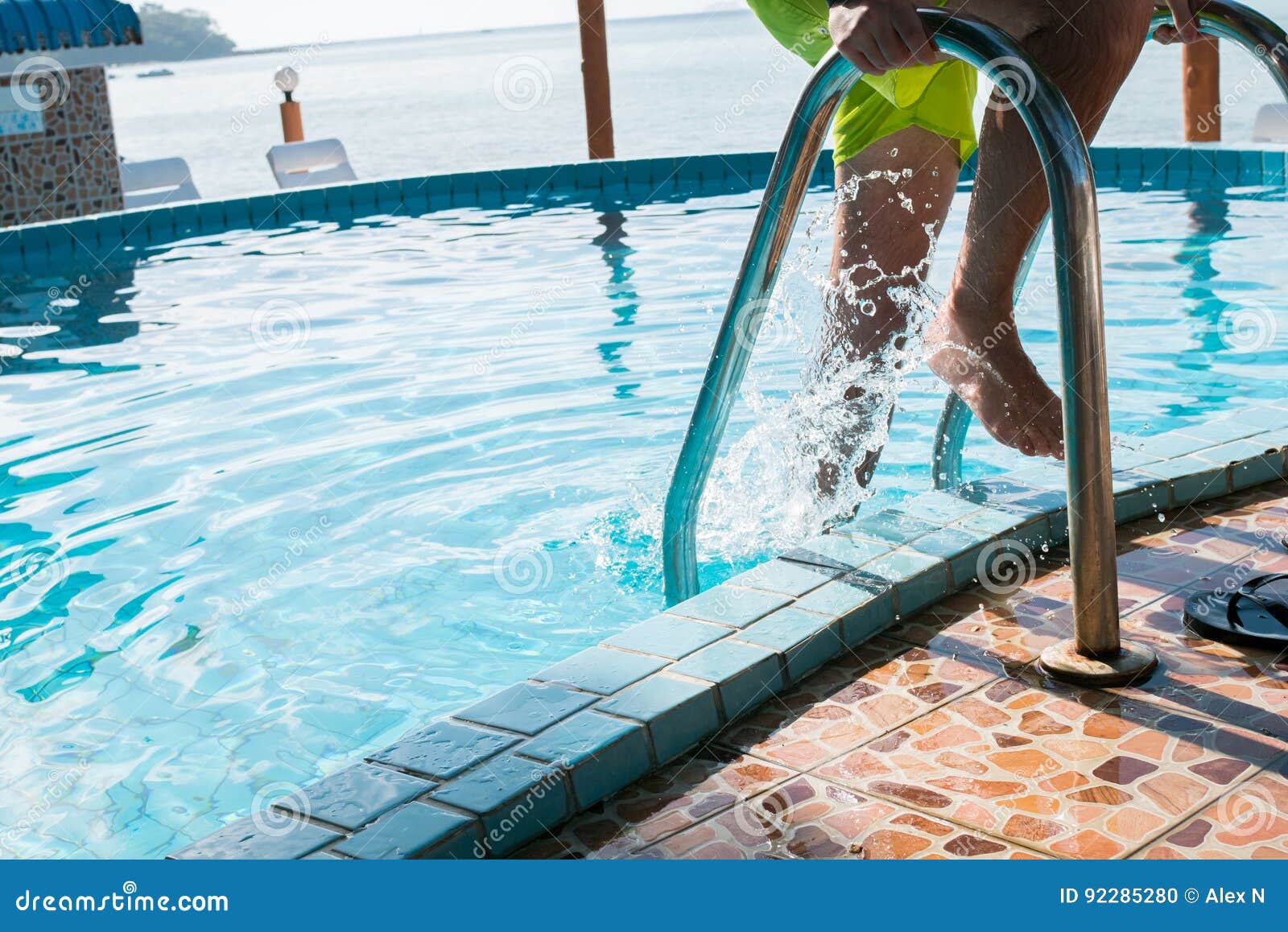 Man in shorts at pool stock photo. Image of enjoying - 92285280