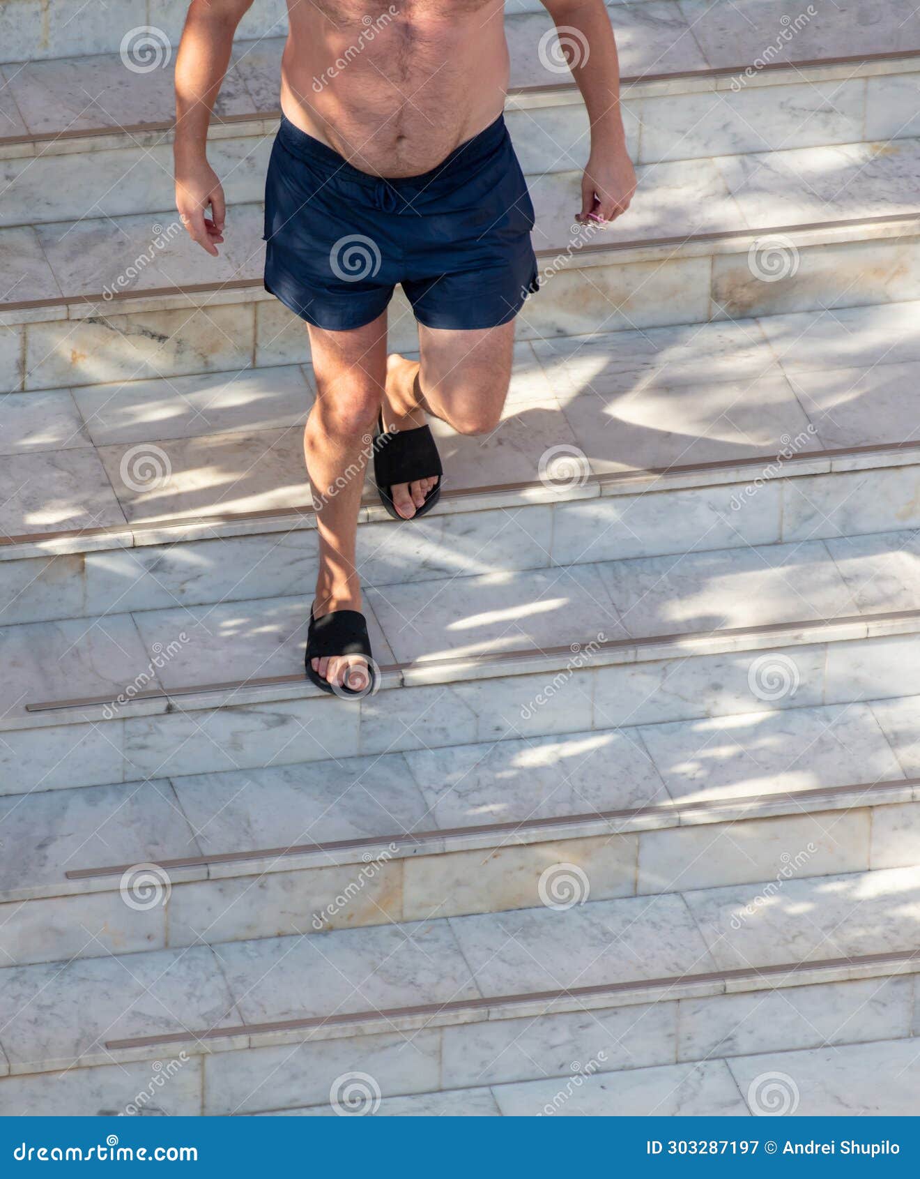 A Man in Shorts Walks Down the Concrete Steps Stock Image - Image of ...