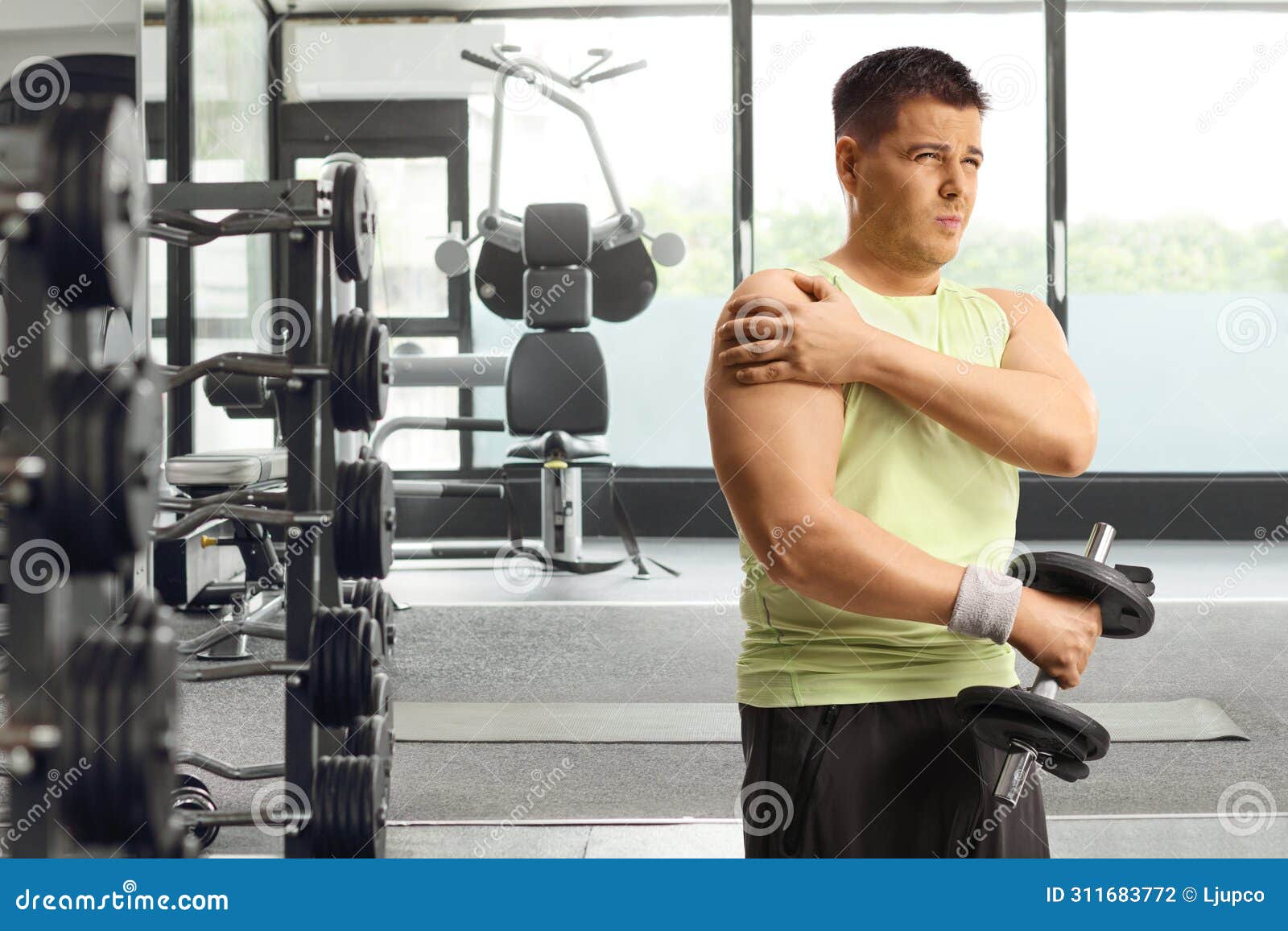 Man with Shoulder Injury Lifting Weights Stock Photo - Image of ...