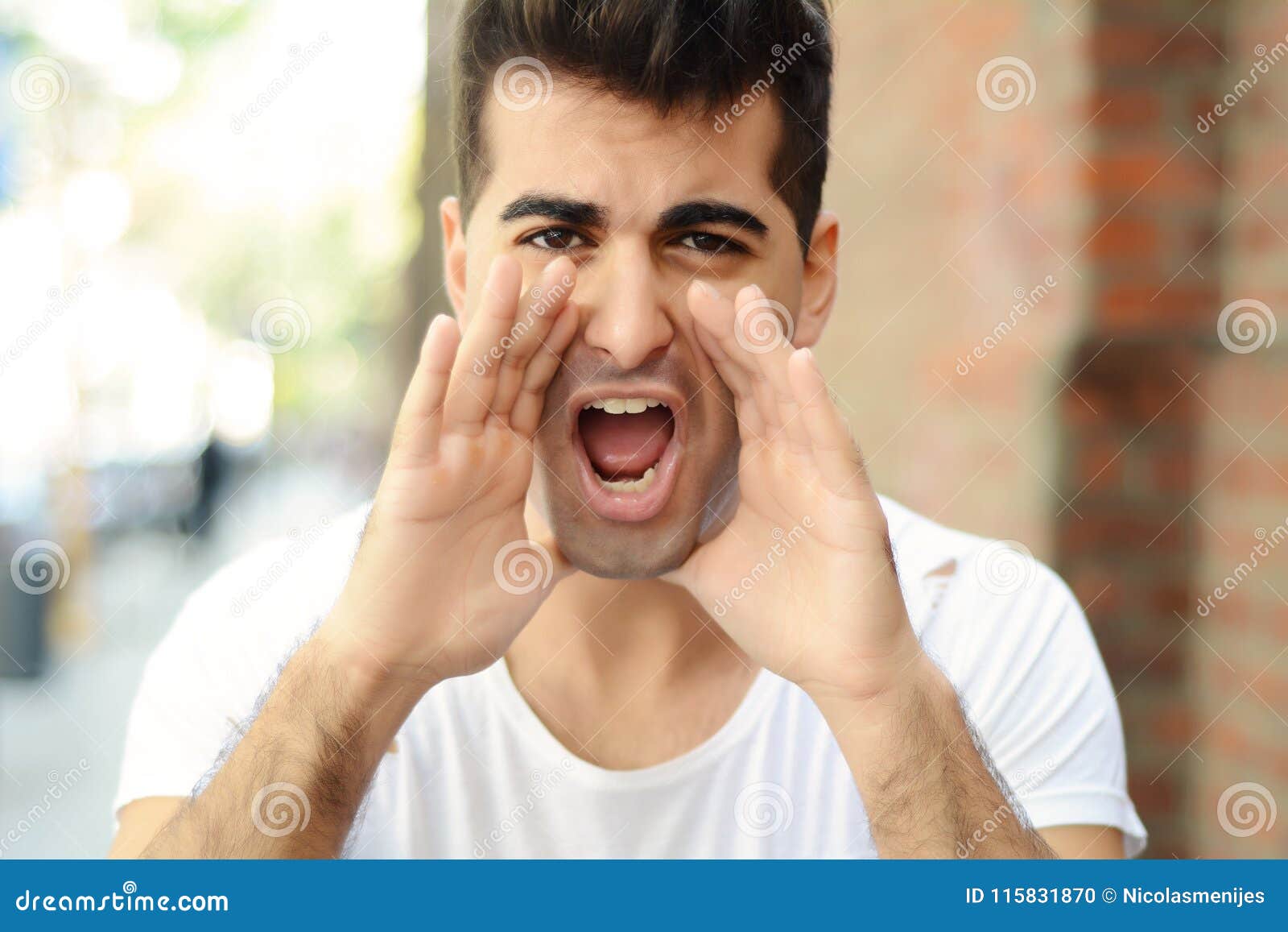 Man shouting at camera. stock photo. Image of announcement - 115831870