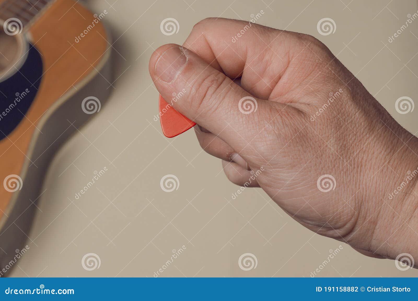 Man Show How To Correctly Hold a Guitar Pick Stock Photo - Image of ...