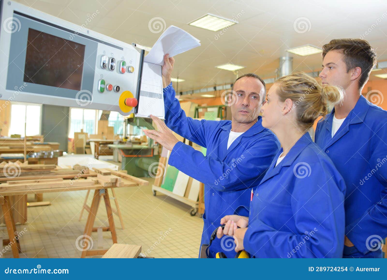 Man Showing Control Panel To Two Apprentices Stock Photo - Image of ...
