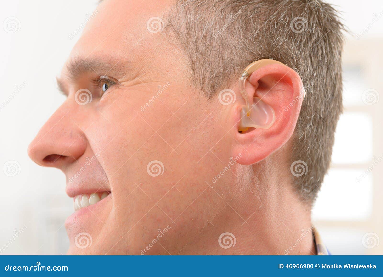 Man showing deaf aids stock photo. Image of medical, instrument - 46966900