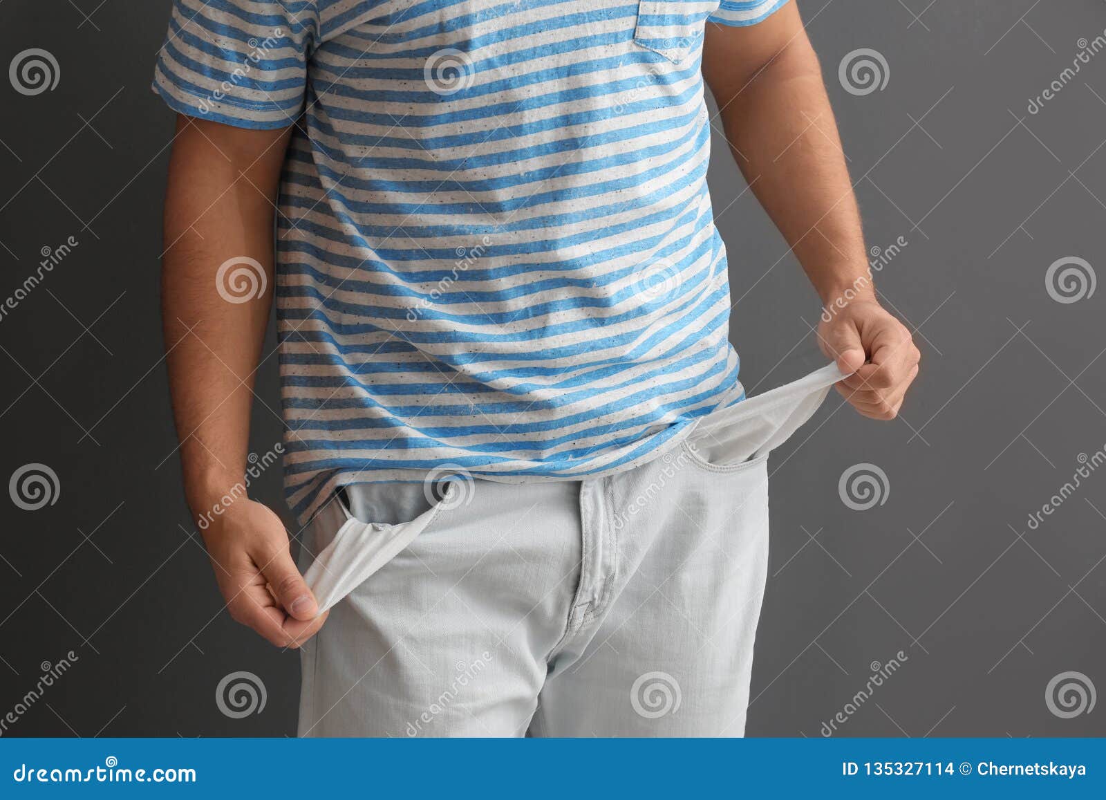Man Showing Empty Pockets on Grey Background Stock Photo - Image of ...