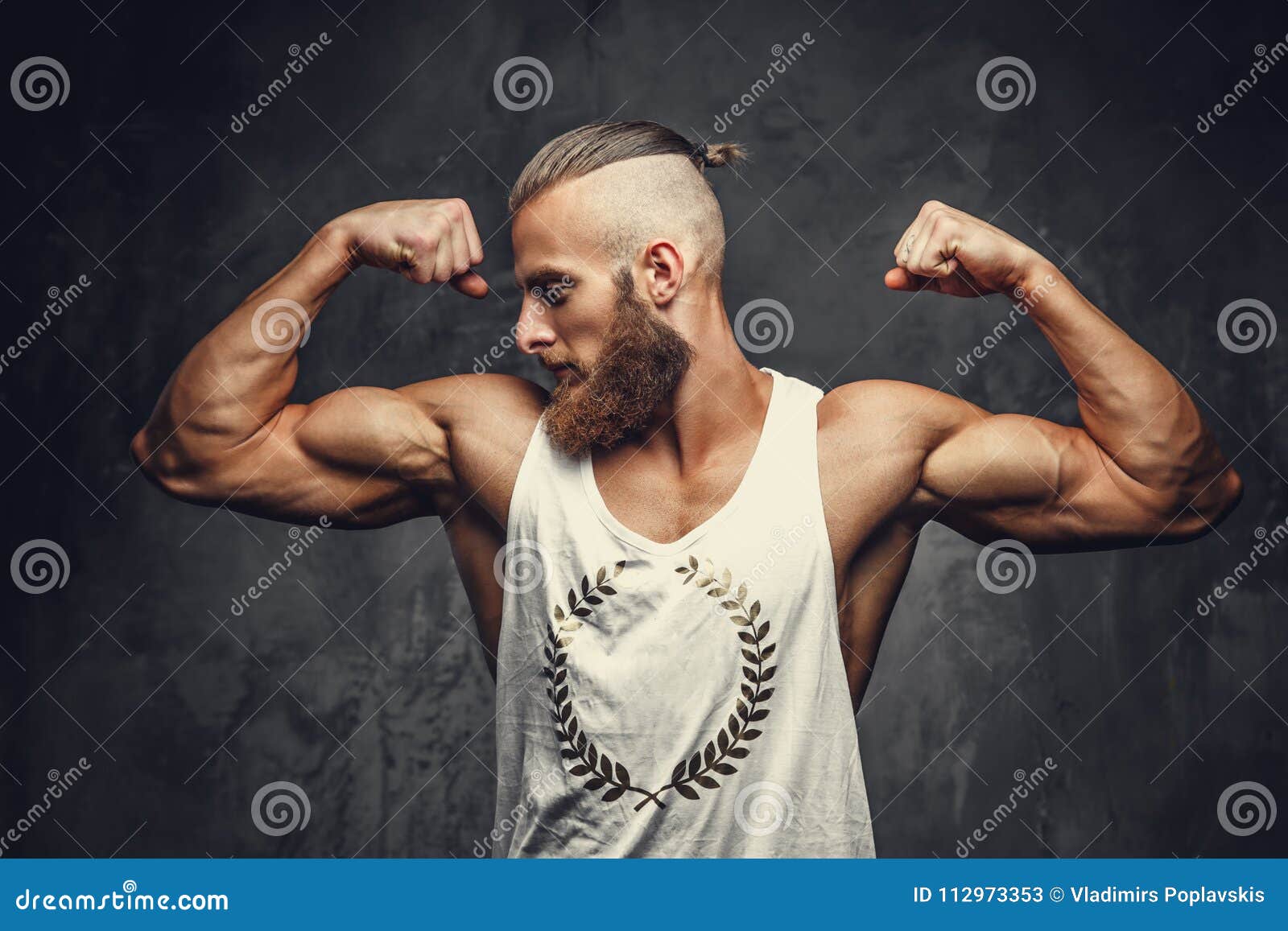 A man showing his biceps. stock image. Image of bodybuilding - 112973353