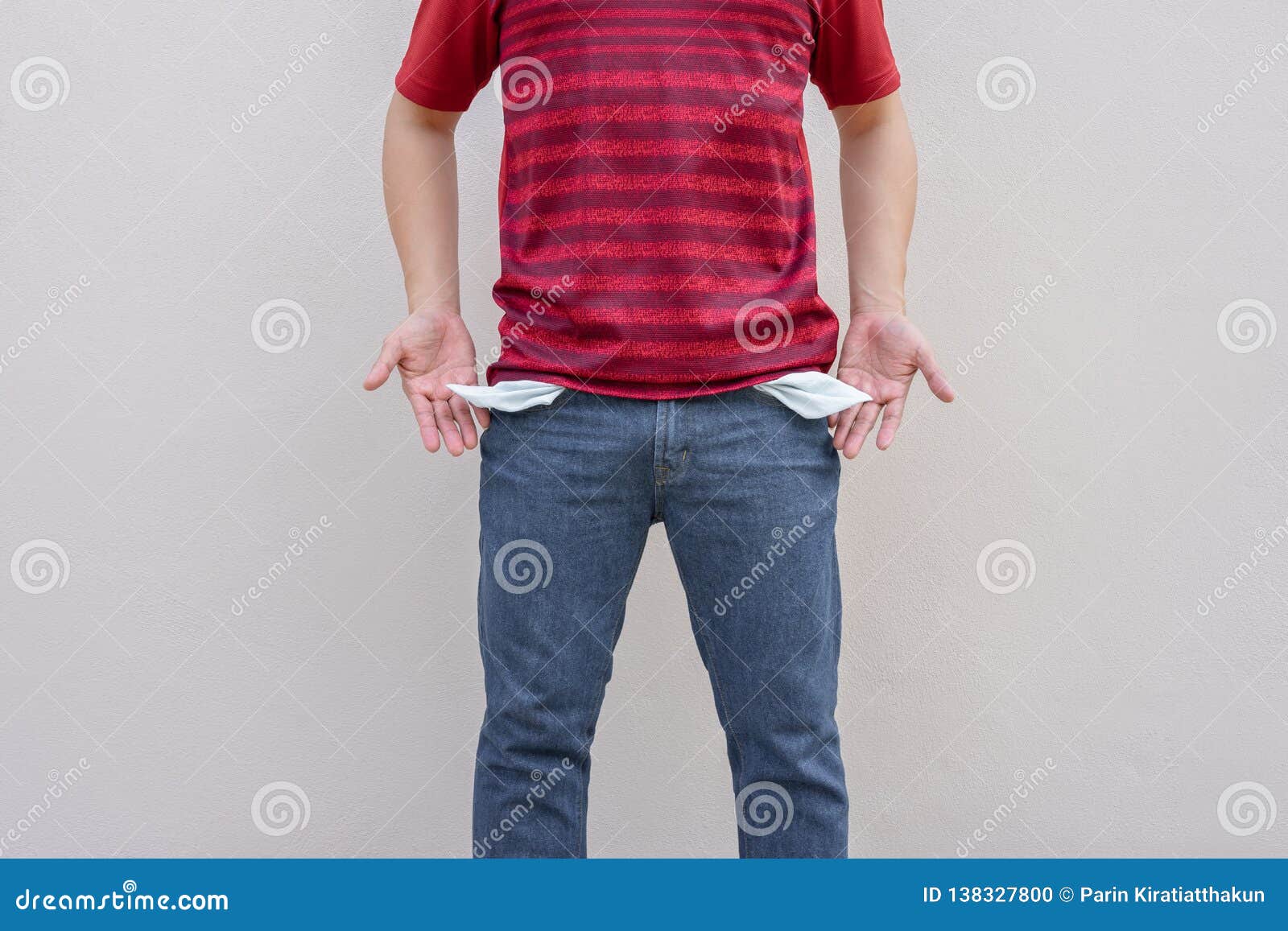 Man Showing His Empty Pockets on Wall Background Stock Photo - Image of ...