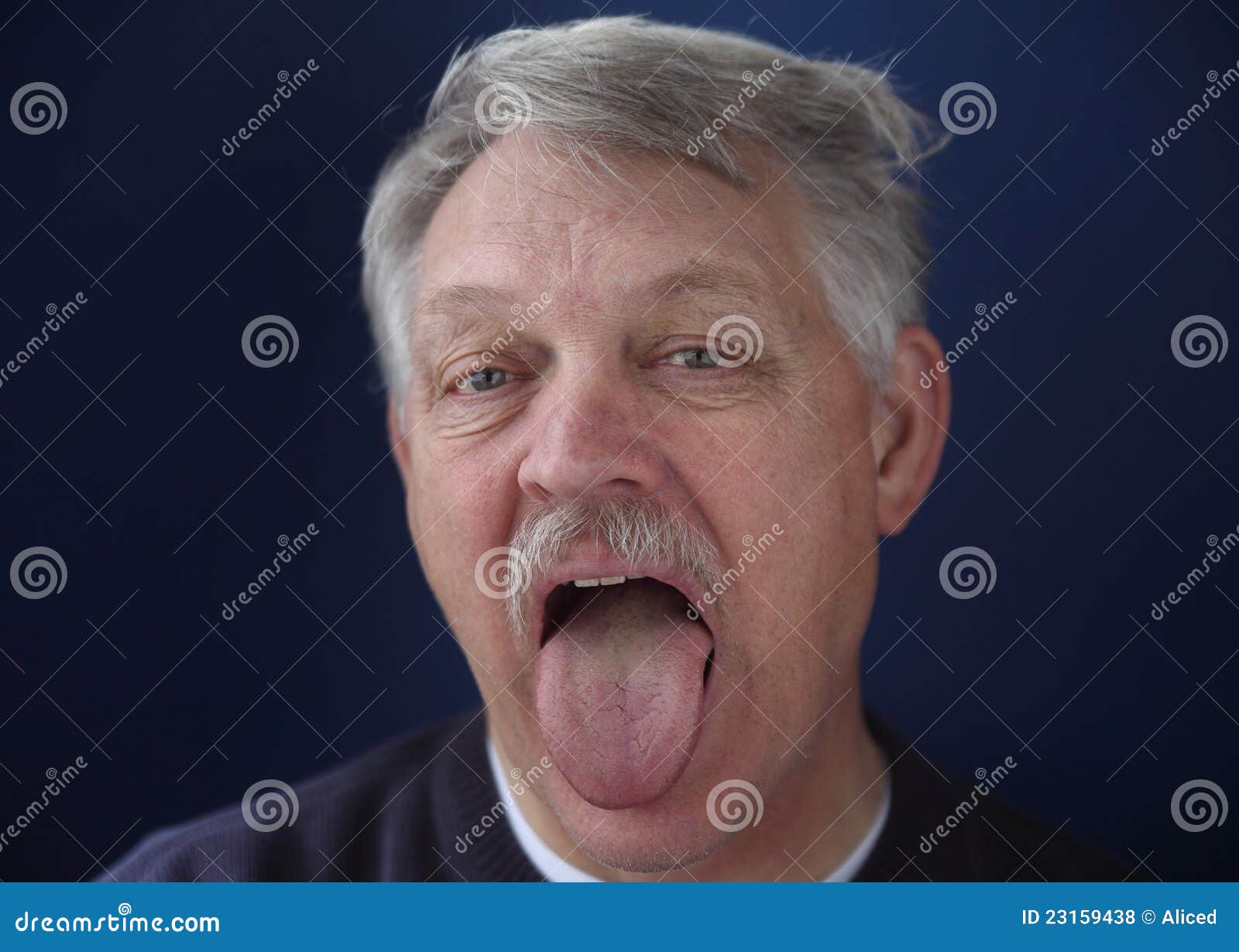 Man showing his tongue stock photo. Image of display - 23159438