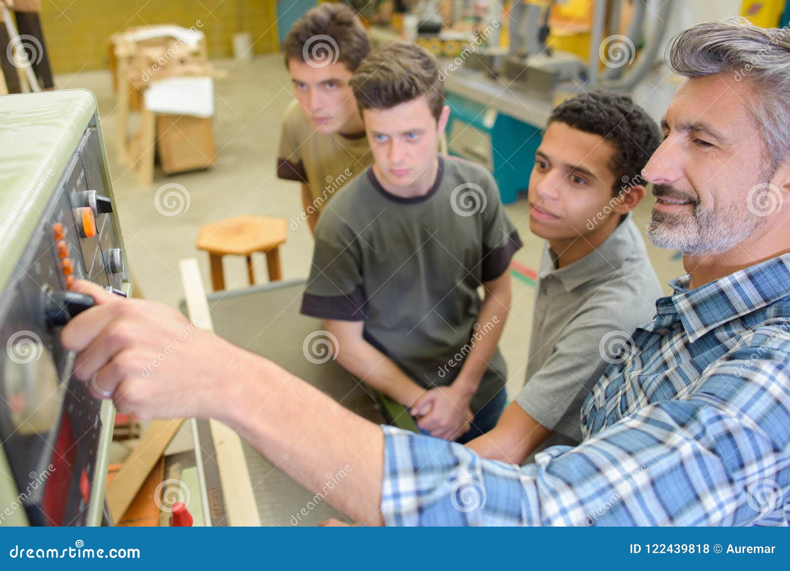 Man Showing How To Start Machine in Workshop Stock Photo - Image of ...