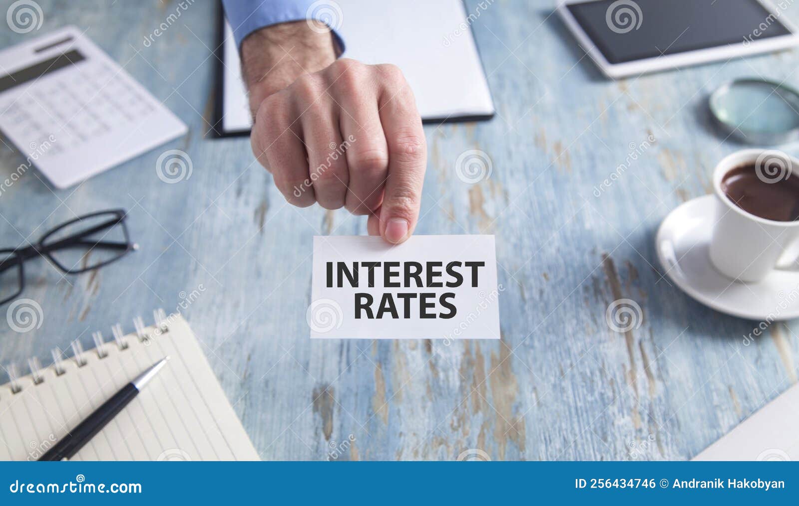 Man Showing Interest Rates Text on Business Card Stock Photo - Image of ...