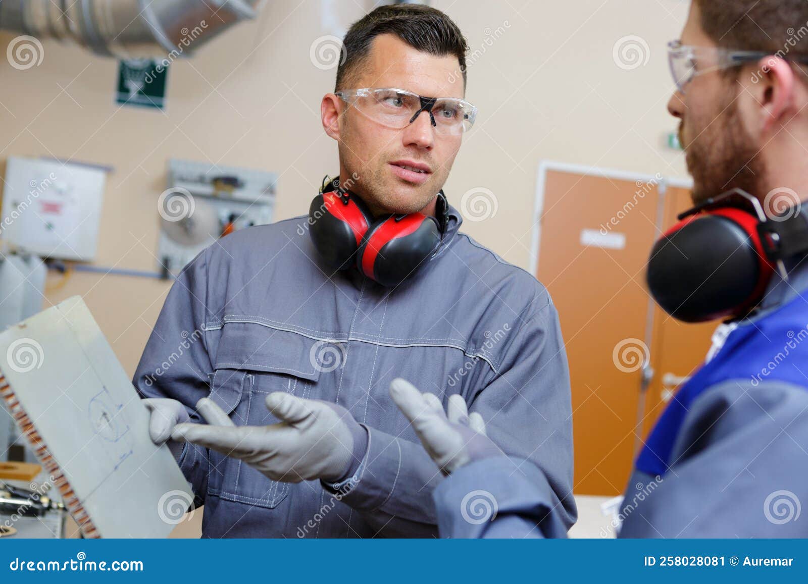 Man Showing Mechanic Colleague Notes Stock Image - Image of vehicle ...