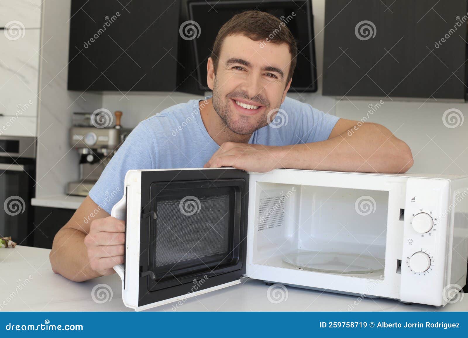 Man Showing a Microwave Oven Stock Image - Image of domestic, dinner ...