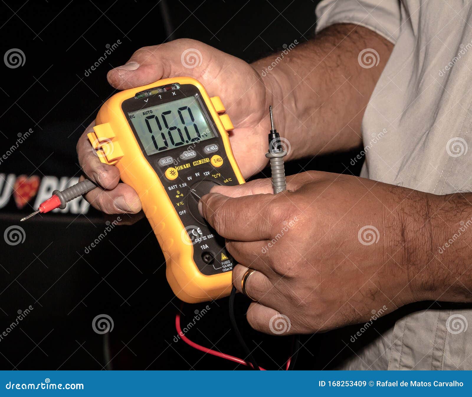 Man showing a multimeter. editorial stock image. Image of checking ...