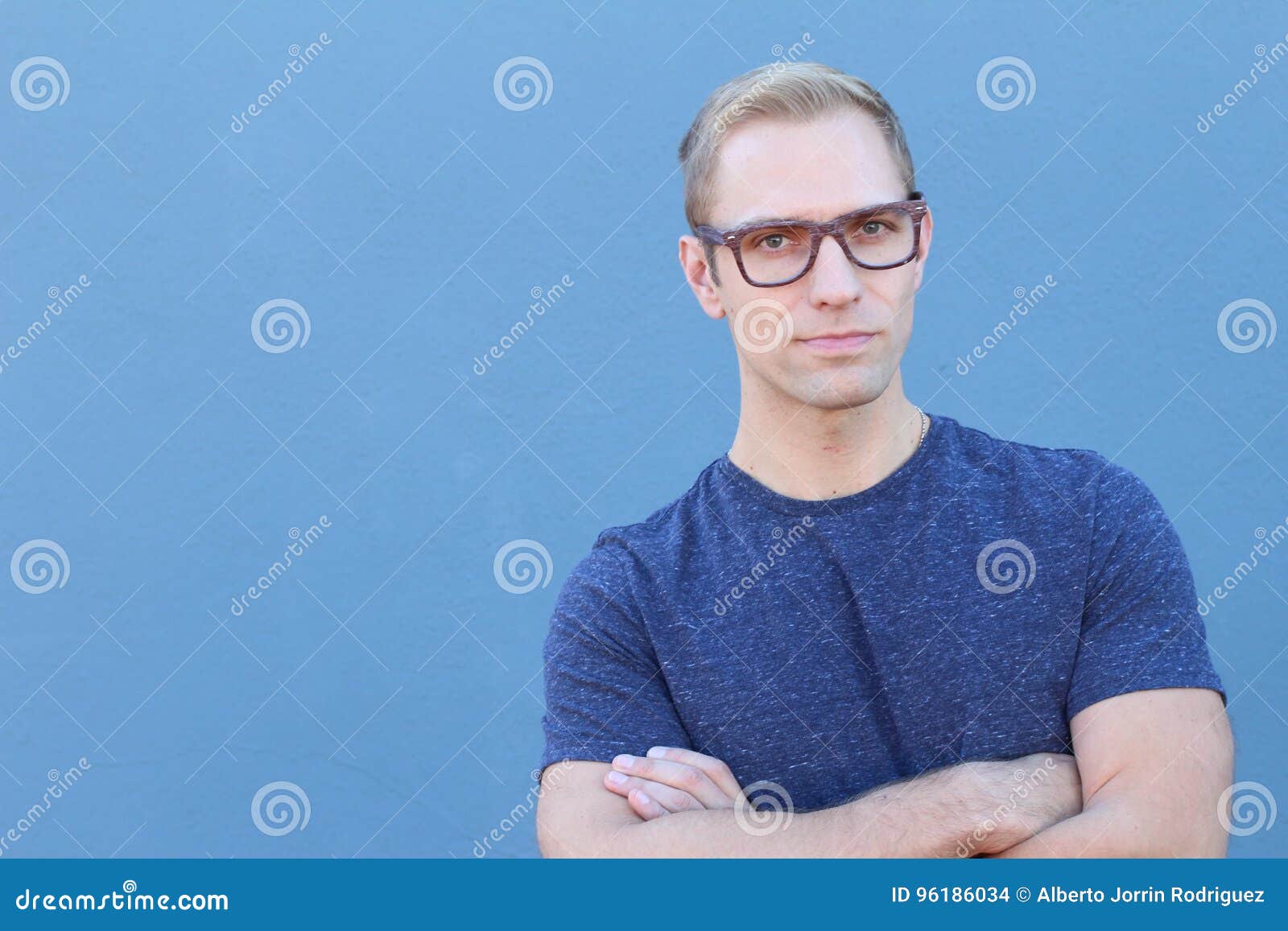 Man Showing Neutral Expression Closeup with Arms Crossed Stock Photo ...