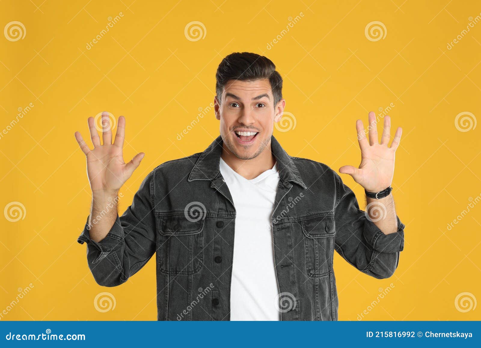 Man Showing Number Ten with His Hands on Yellow Background Stock Photo ...
