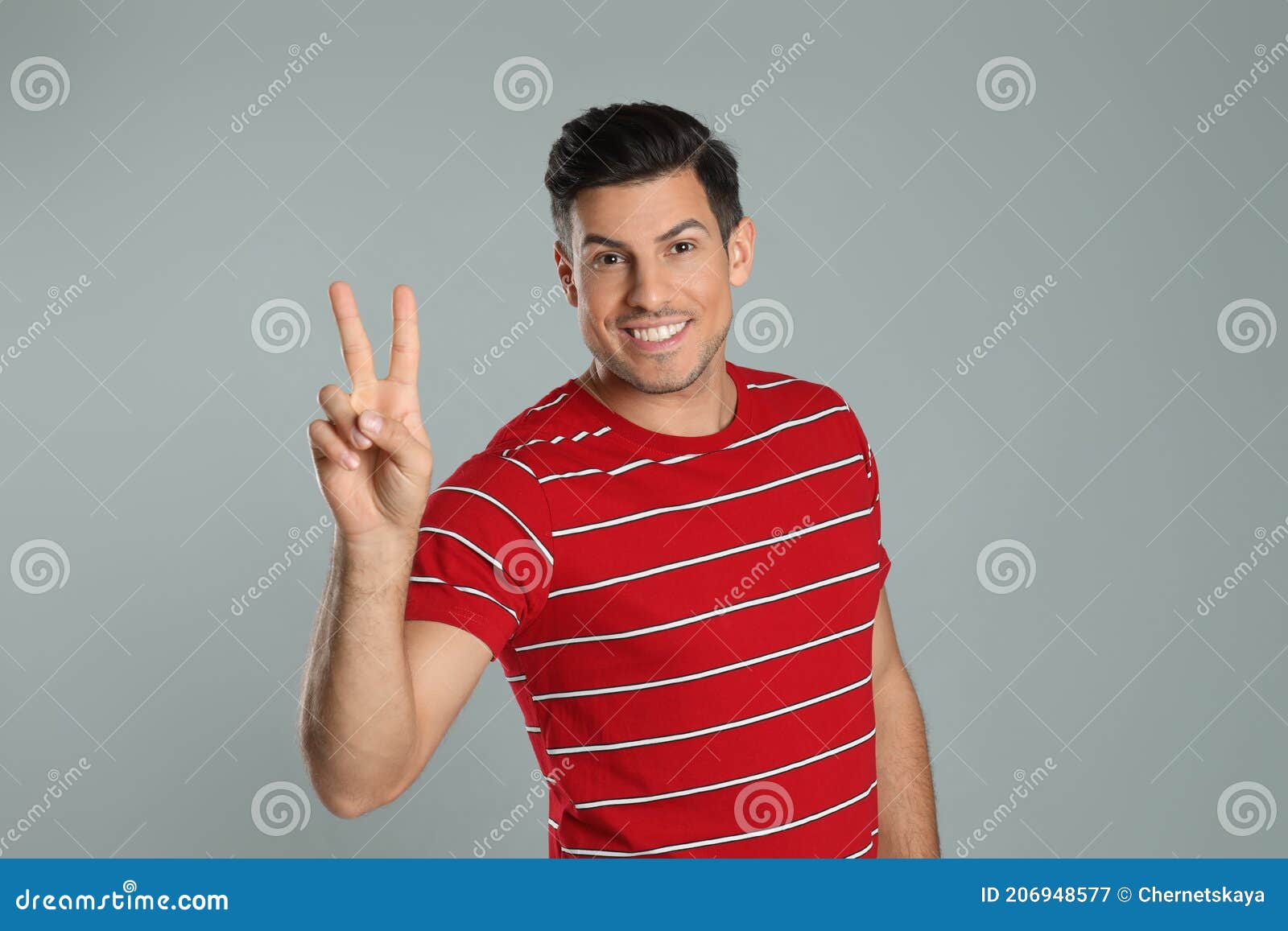 Man Showing Number Two with His Hand on Grey Background Stock Image ...