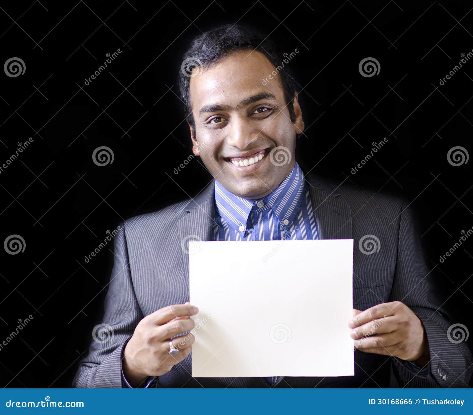 A Handsome Man Showing a Paper Stock Photo - Image of businessman, male ...