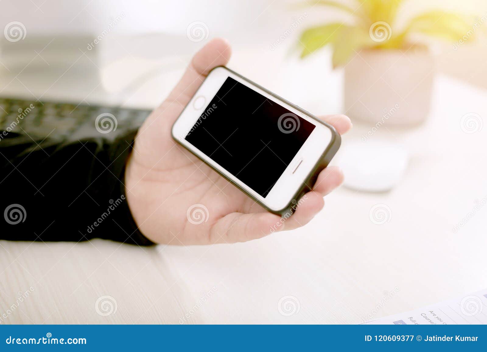 Man showing phone in hand. stock image. Image of desktop - 120609377