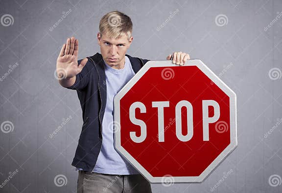Man showing stop sign. stock image. Image of isolated - 28588709