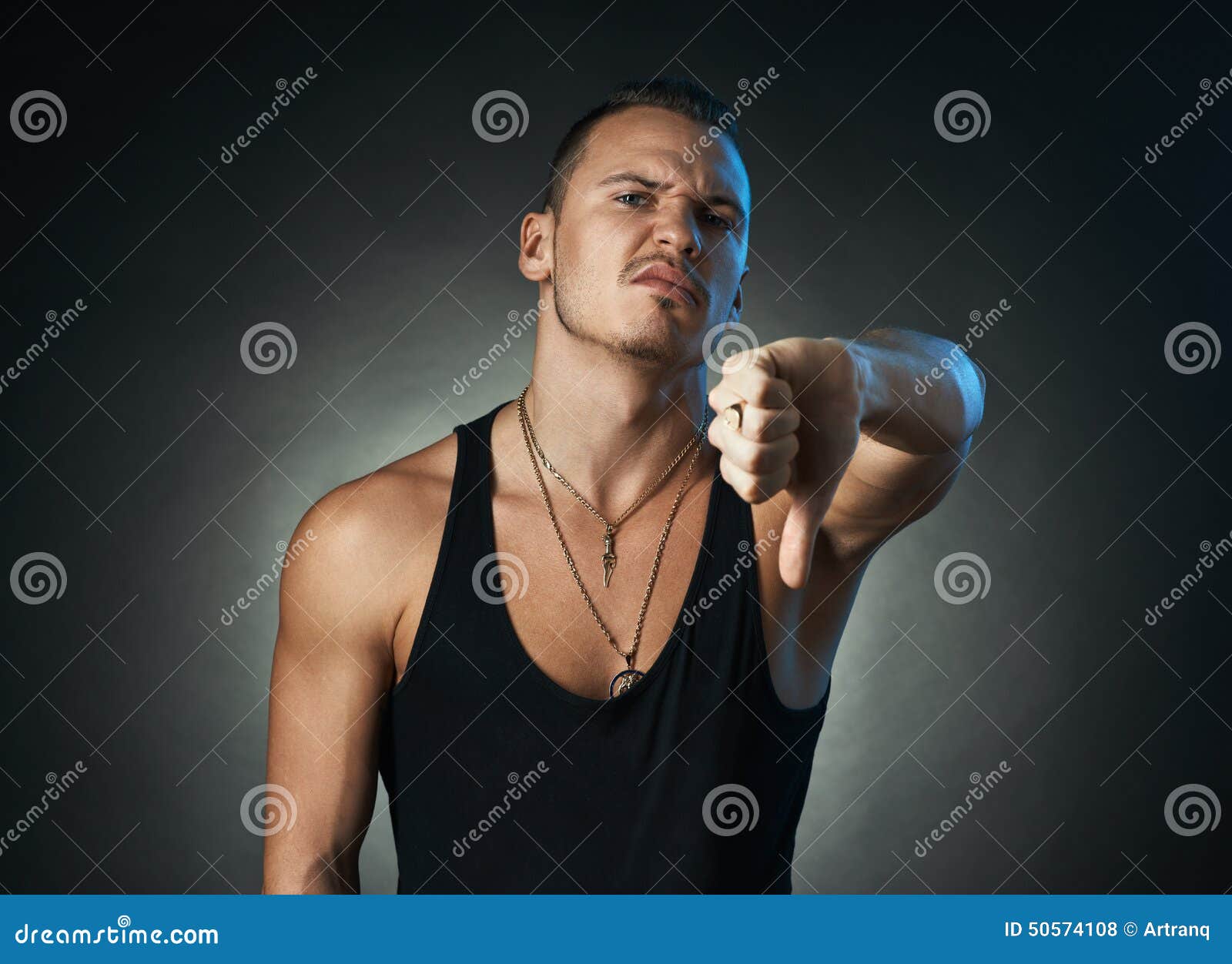Man Showing Thumbs Down on Black Background Stock Photo - Image of ...