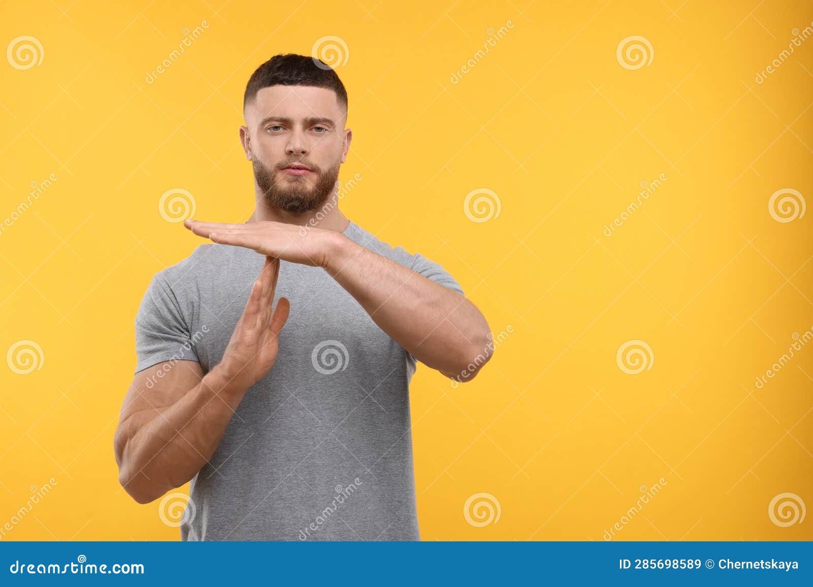 Man Showing Time Out Gesture on Orange Background, Space for Text Stock ...