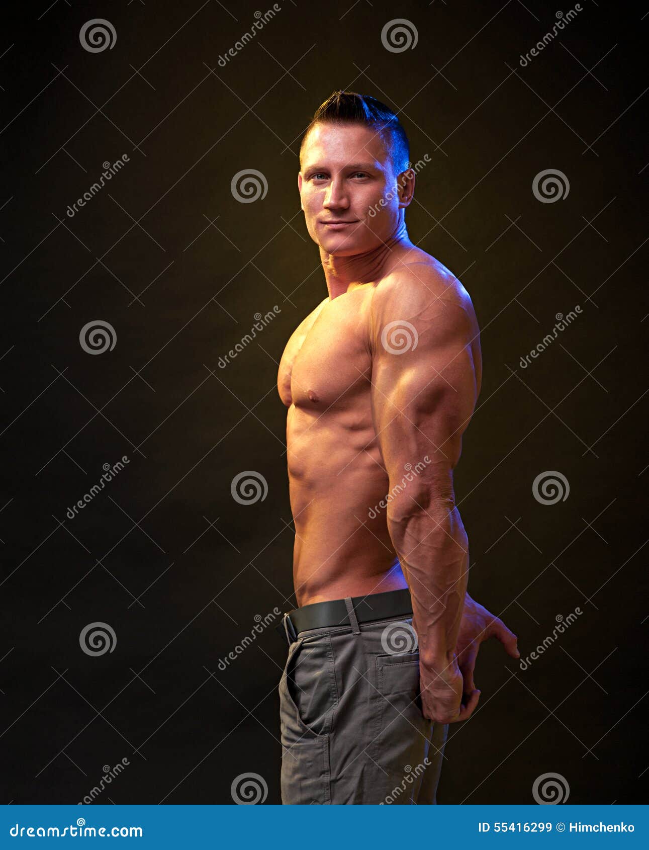 Man showing triceps muscle stock image. Image of studio - 55416299