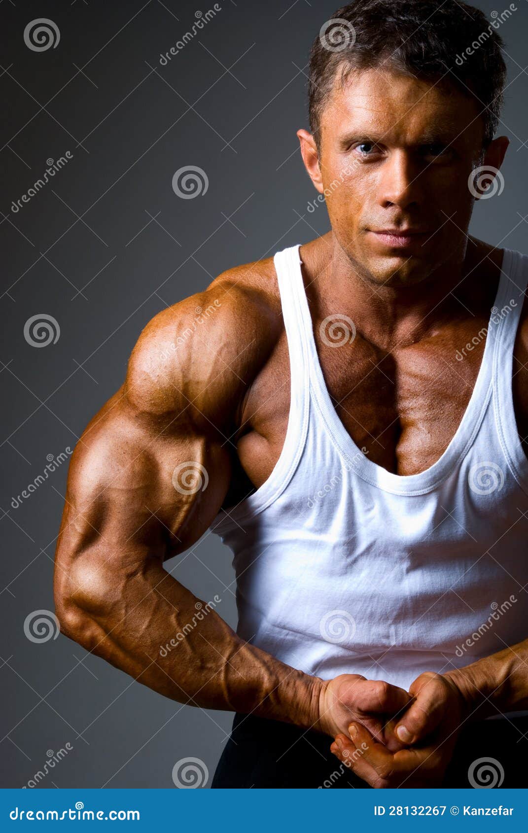 A Man Shows His Muscles In The Studio Stock Image | CartoonDealer.com ...