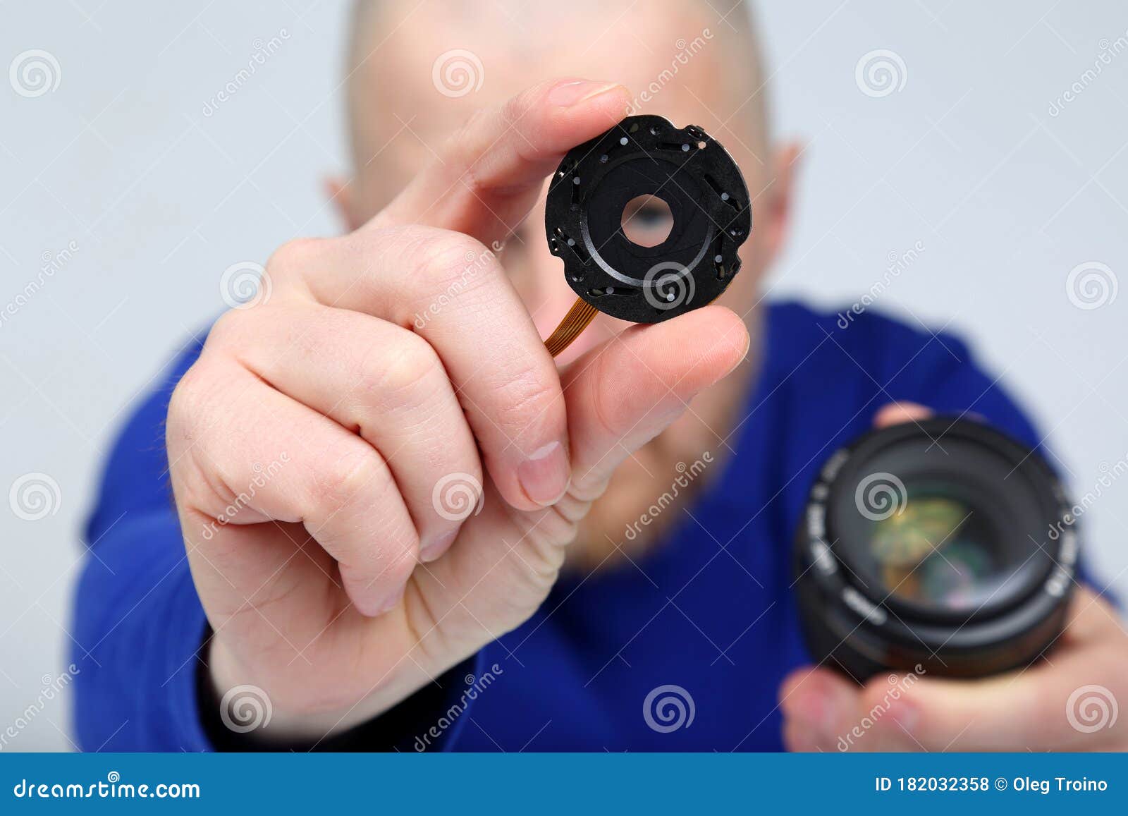 Man Shows Part of the Diaphragm of the Camera Lens Stock Photo - Image ...