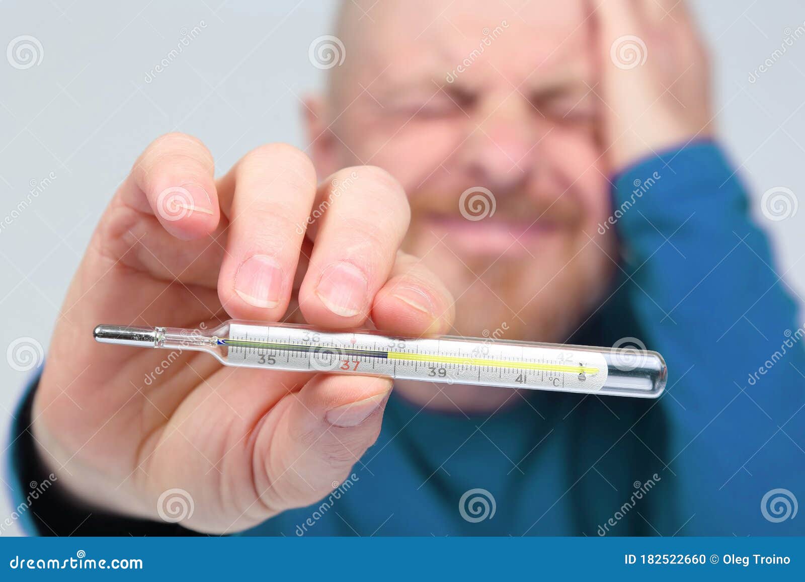 Man Shows a Thermometer with a High Temperature Stock Photo - Image of ...