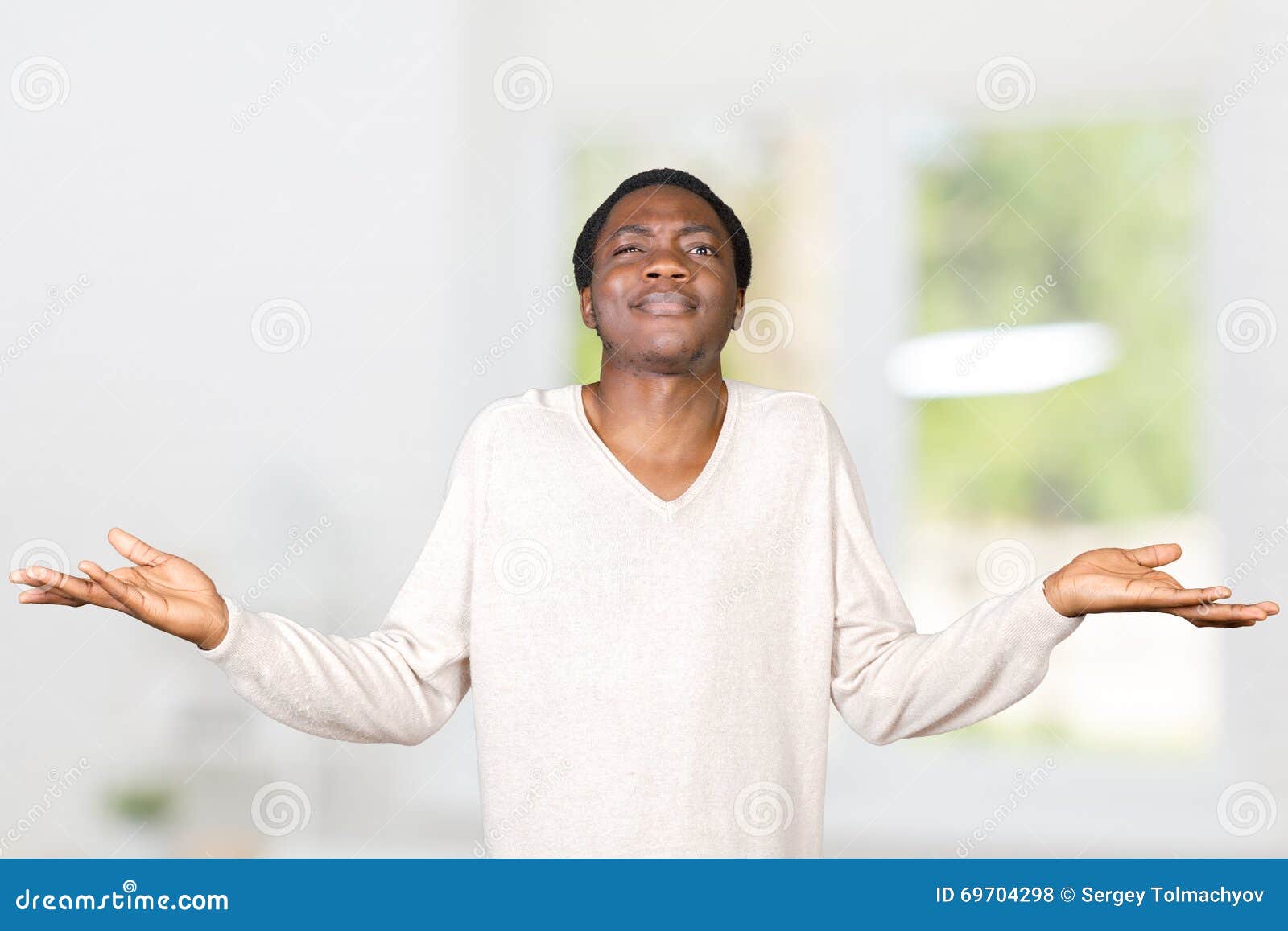 Man shrugging shoulders stock photo. Image of expressive - 69704298